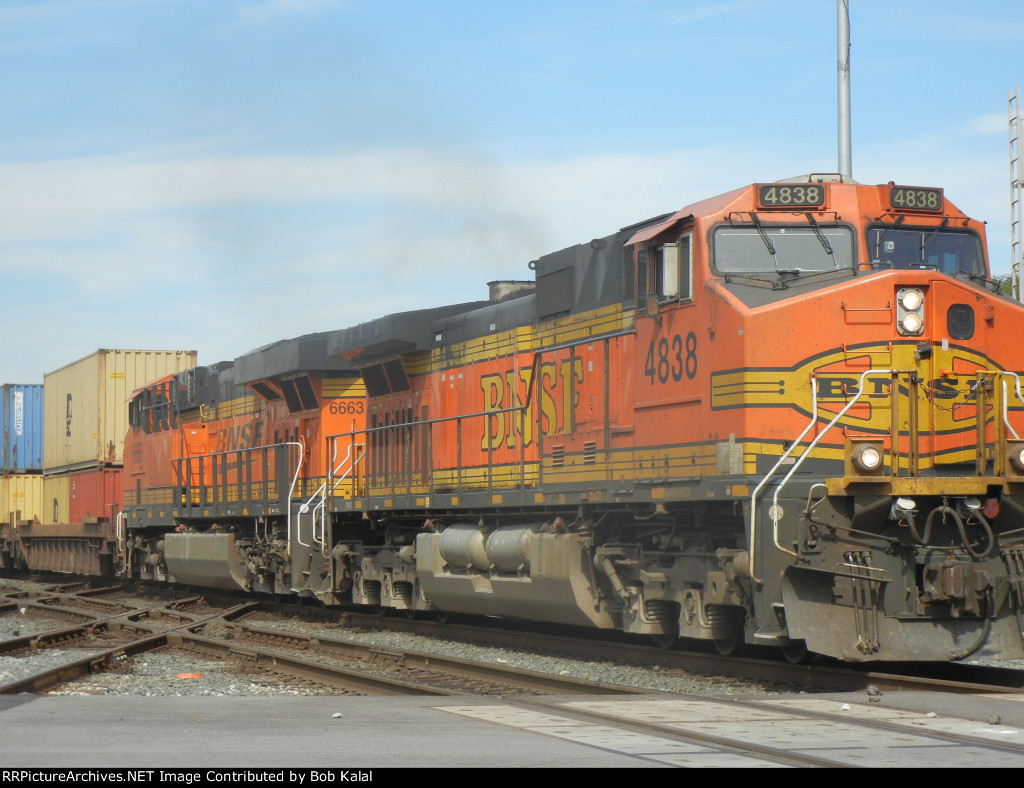 BNSF 4838 6663 container train crosses diamonds